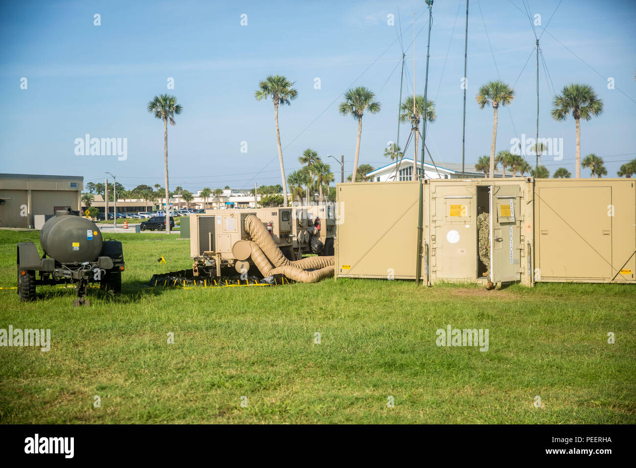 A Navy Tactical Operations Center (TOC) rests in a field aboard Naval ...