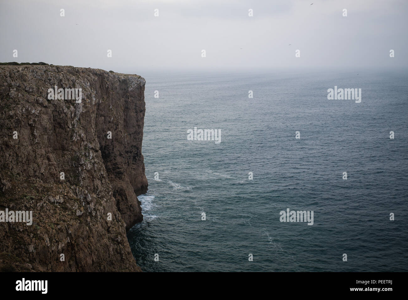 High rocky cliff at Atlantic ocean Stock Photo - Alamy