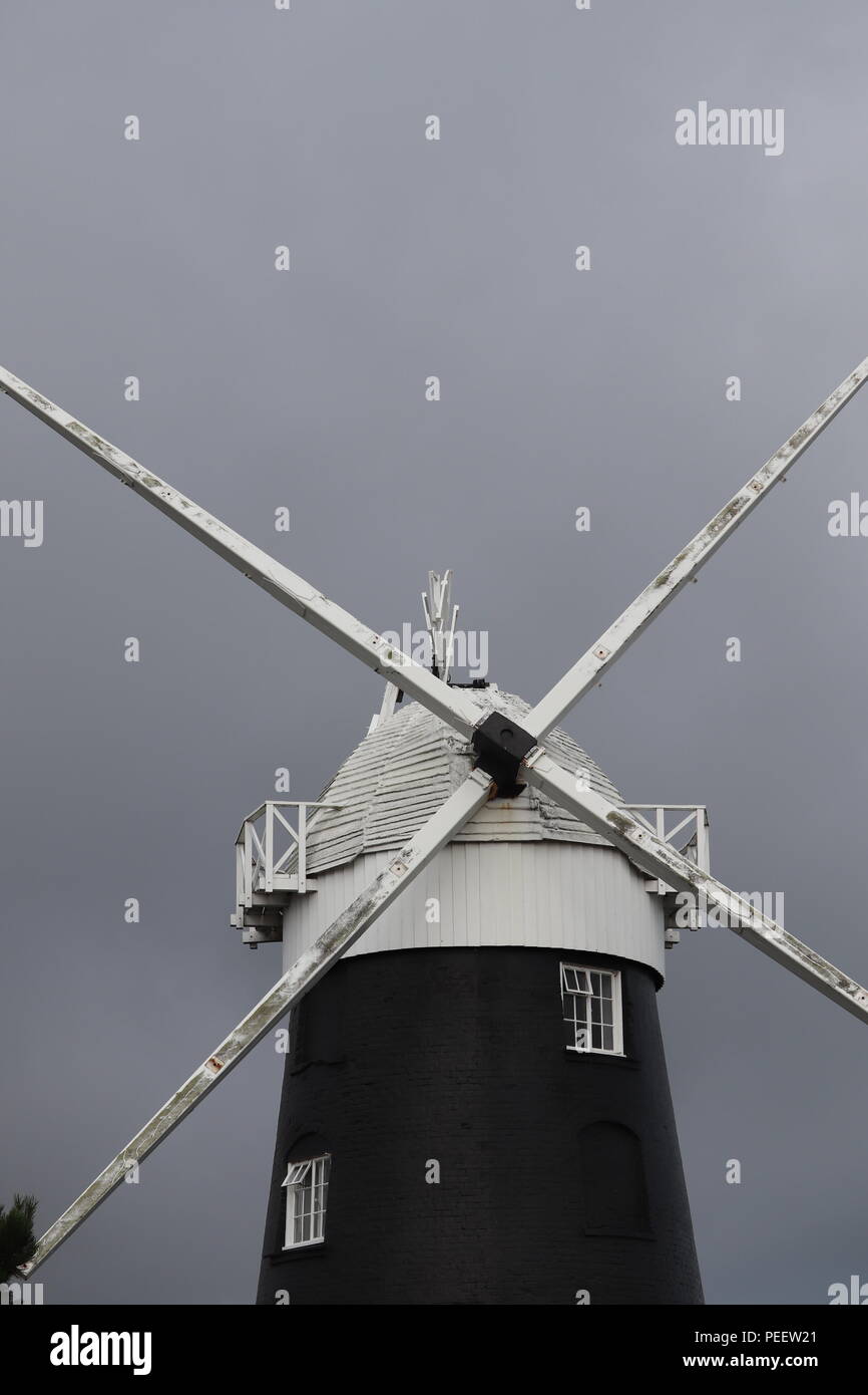 Windmill with white sails and grey building, was a windmill now a house ...