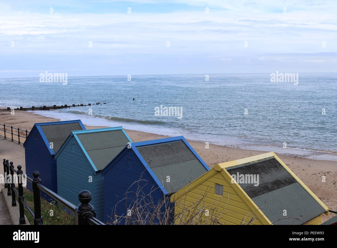Beach huts the colours of the rain on tne seafront .east coast ...