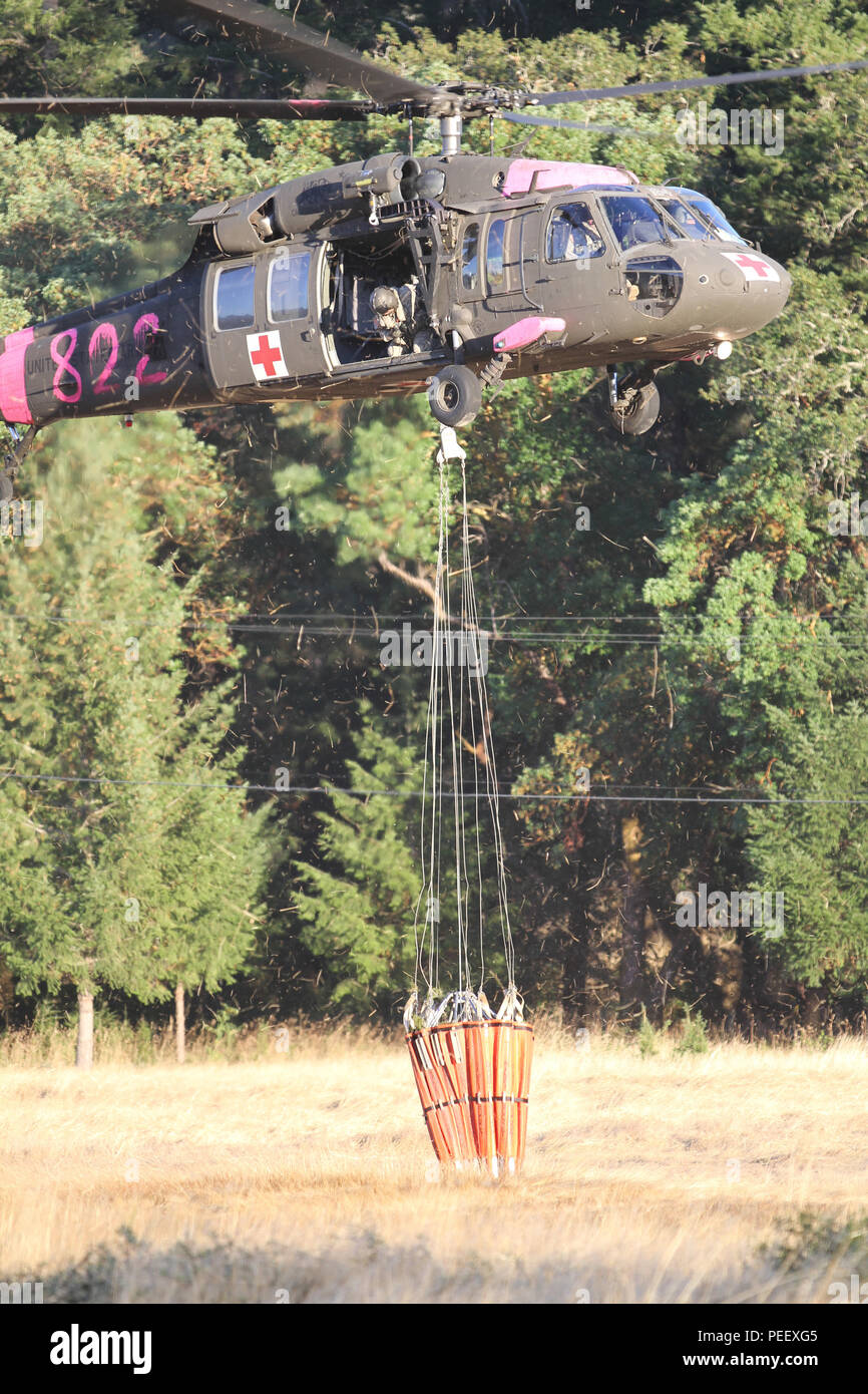 A UH-60 Black Hawk from the California Army National Guard lowers its ...