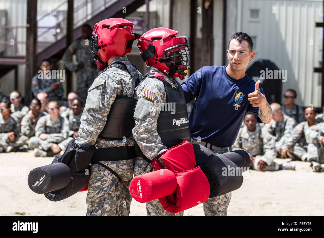 The referee gives the thumbs-up signalling the start of the round during pugil stick training ...