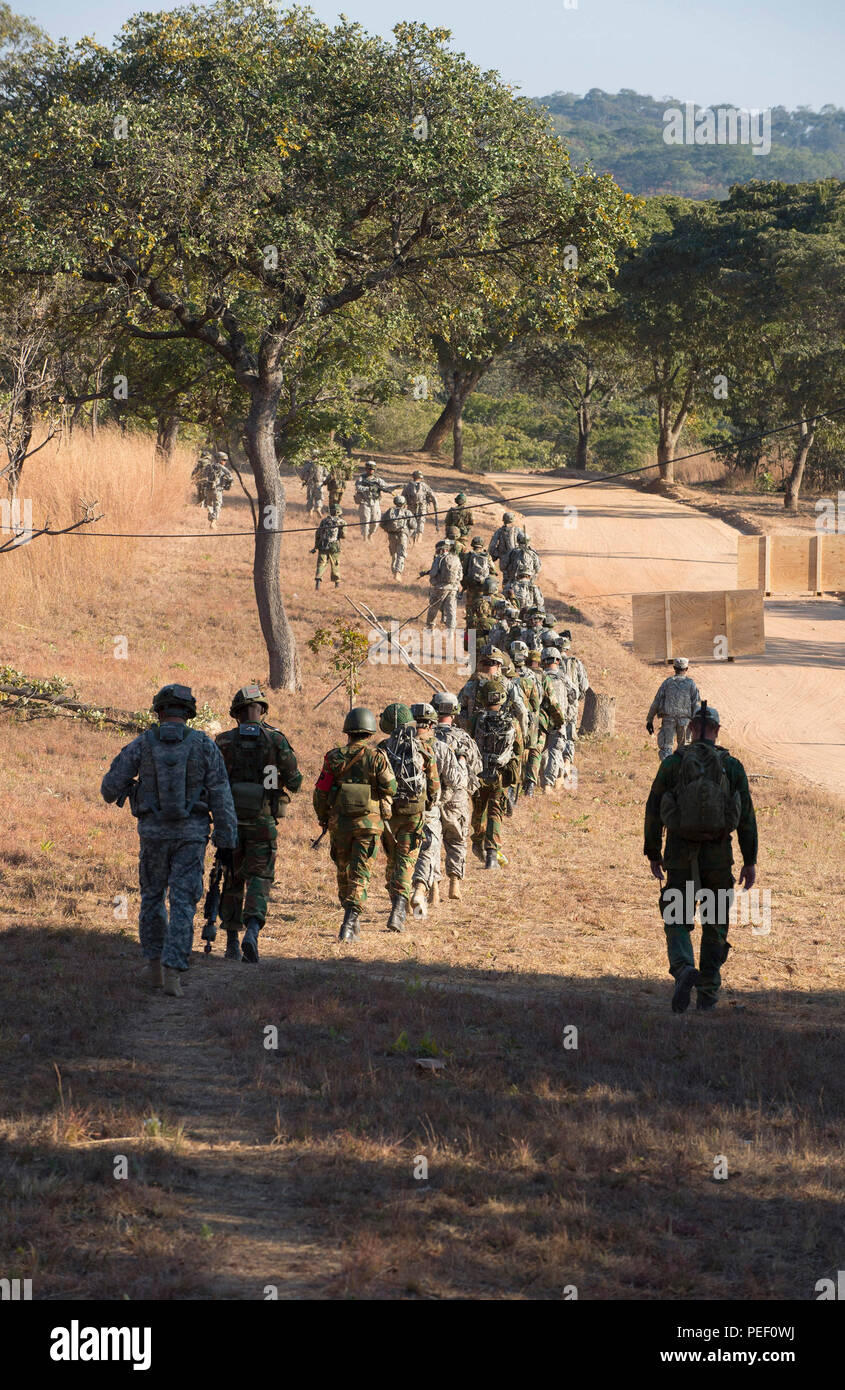U.S. Army Soldiers along side members of the Zambian Defense Force move ...