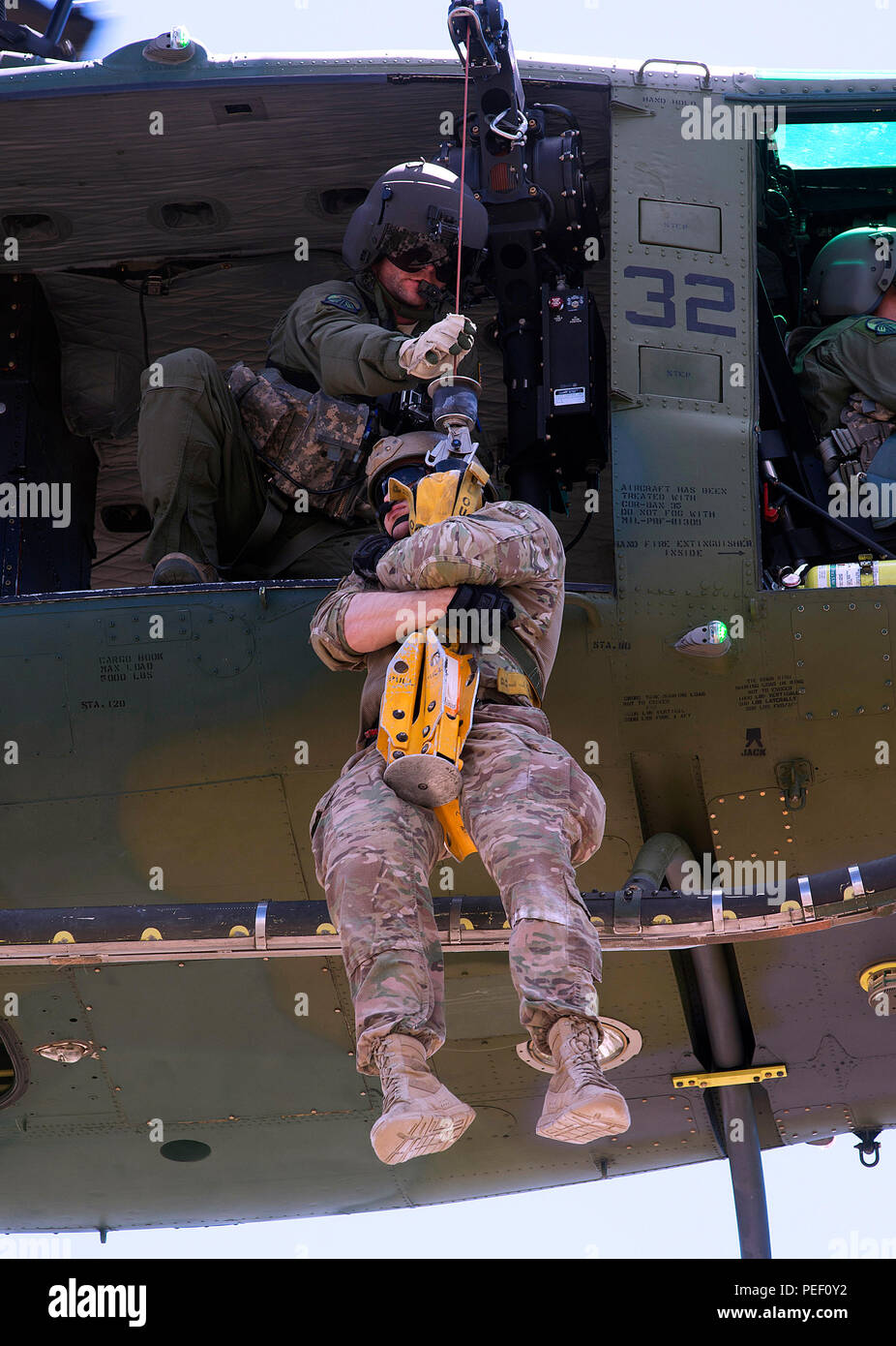 Staff Sgt. Brad Reeves, 37th Helicopter Squadron, helps Senior Airman Jake Aragona, 790th ...