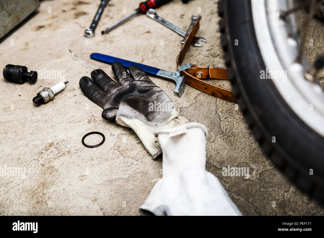 Tools for repairing motorcycle and gloves close up Stock Photo - Alamy