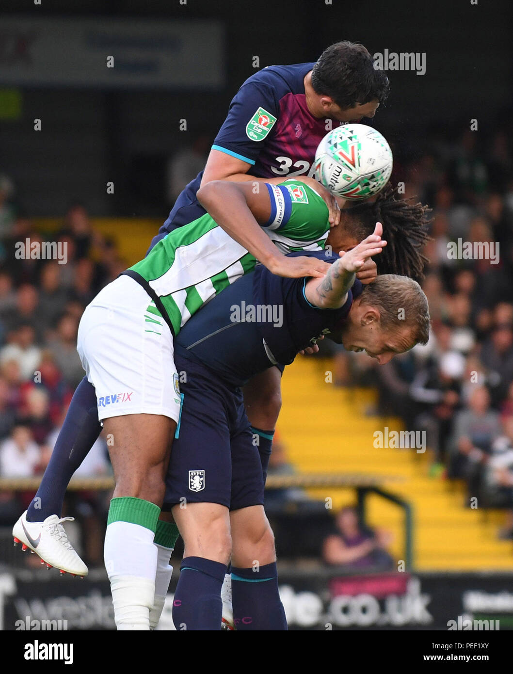 Yeovil towns omar sowunmi sandwiched between two villa players hi-res ...