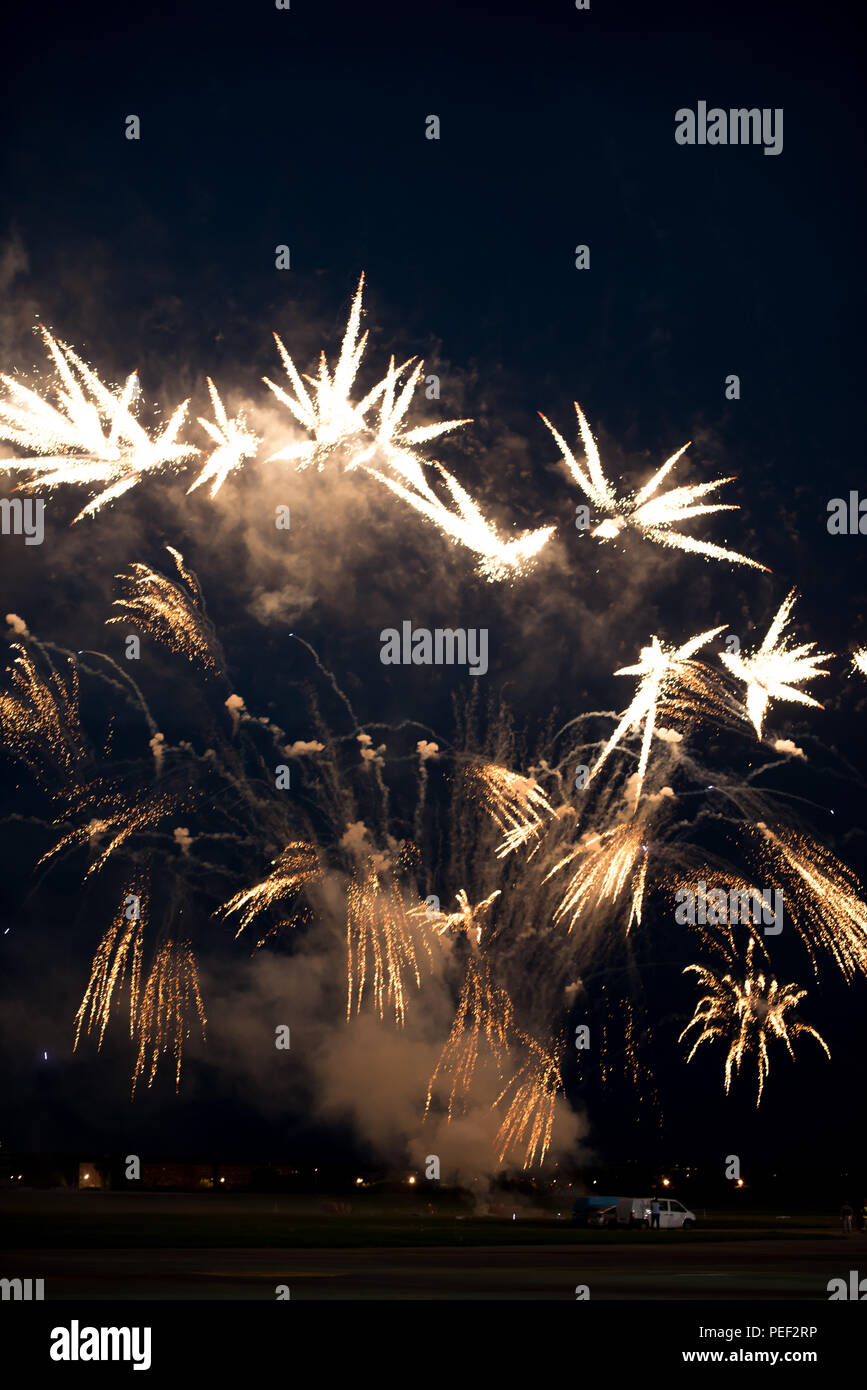 Multiple golden fireworks Stock Photo - Alamy
