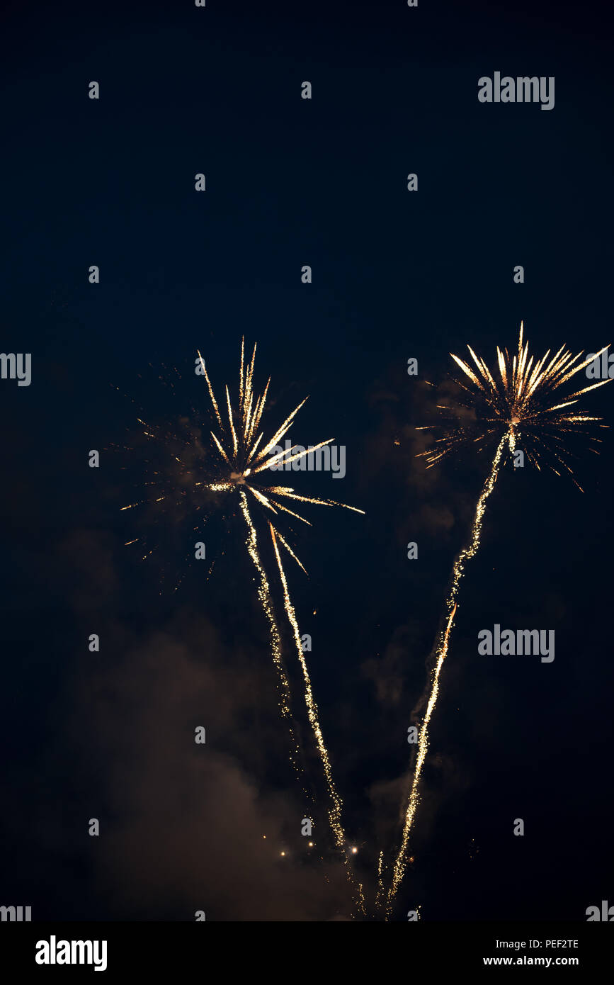 Multiple golden fireworks Stock Photo - Alamy