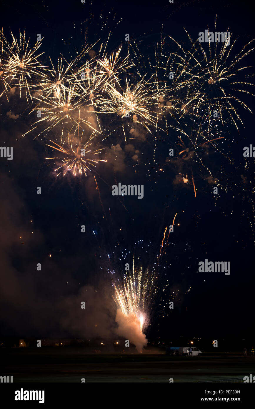 Multiple golden fireworks Stock Photo - Alamy