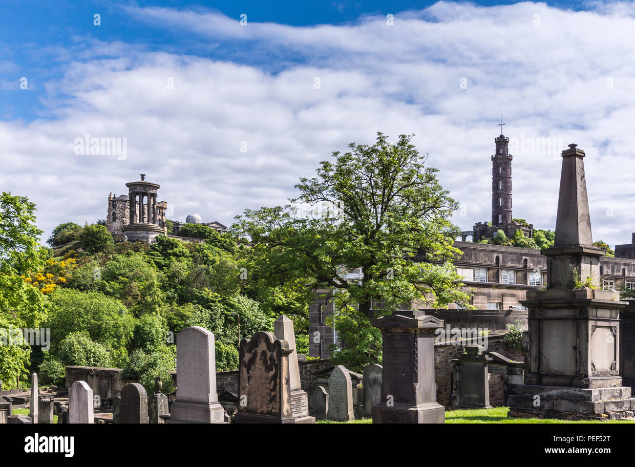 Edinburgh, Scotland, UK - June 13, 2012: Rows of brown tomb stones set ...