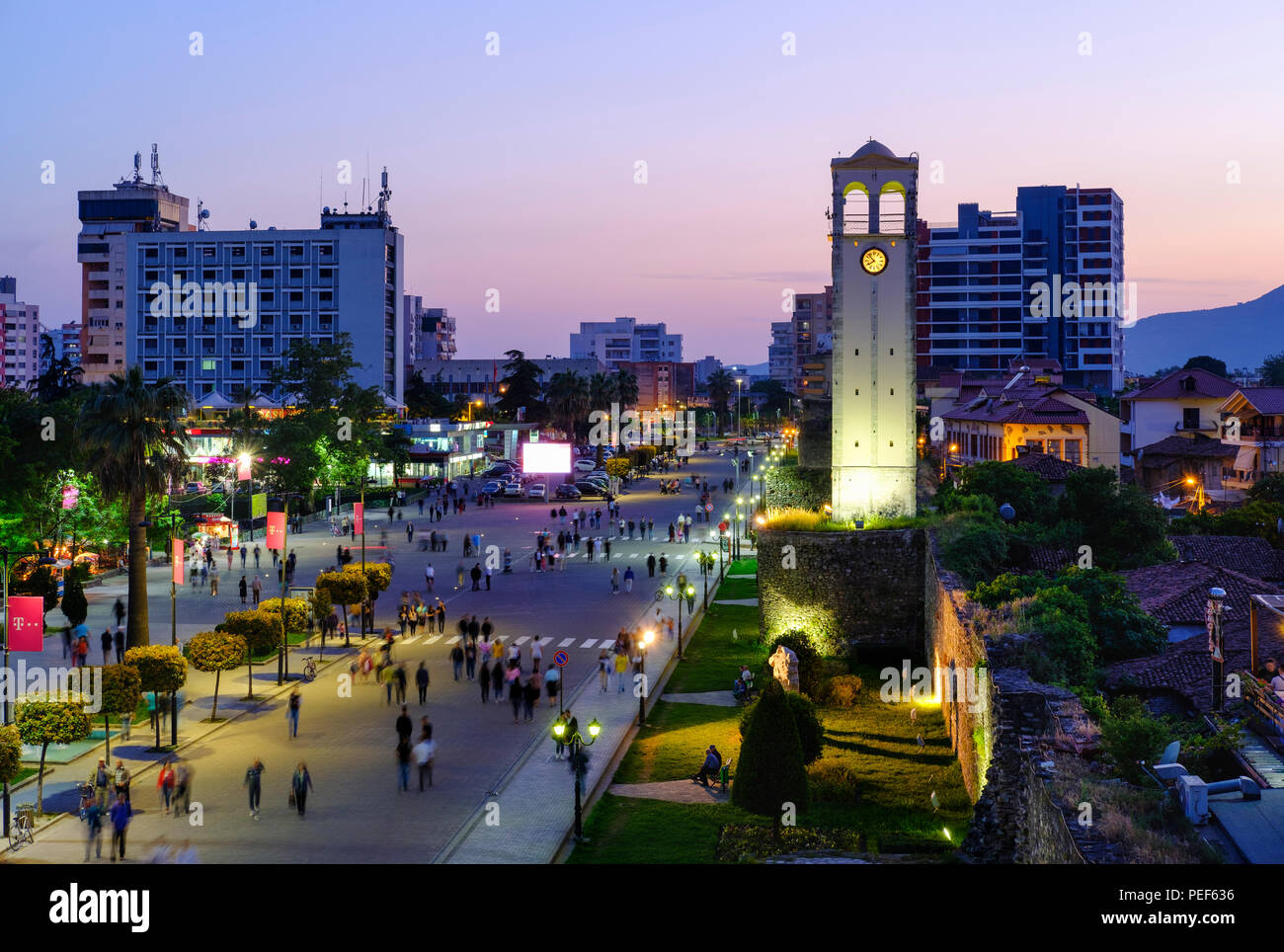 Pedestrian area, fortress wall and clock tower, dusk, Elbasan, Albania ...