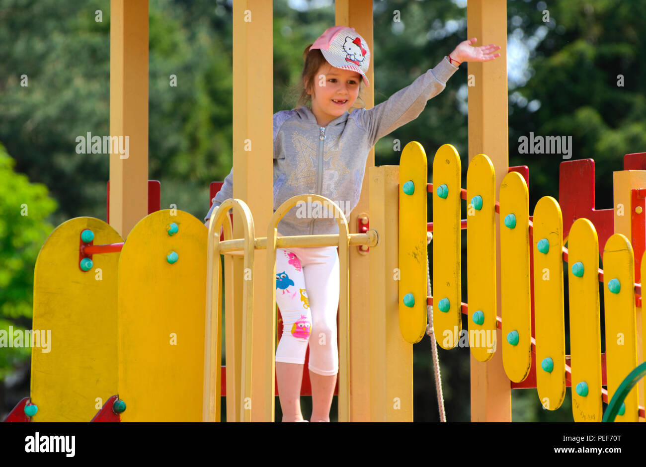 Little children run around and play in the playground. Game center for ...