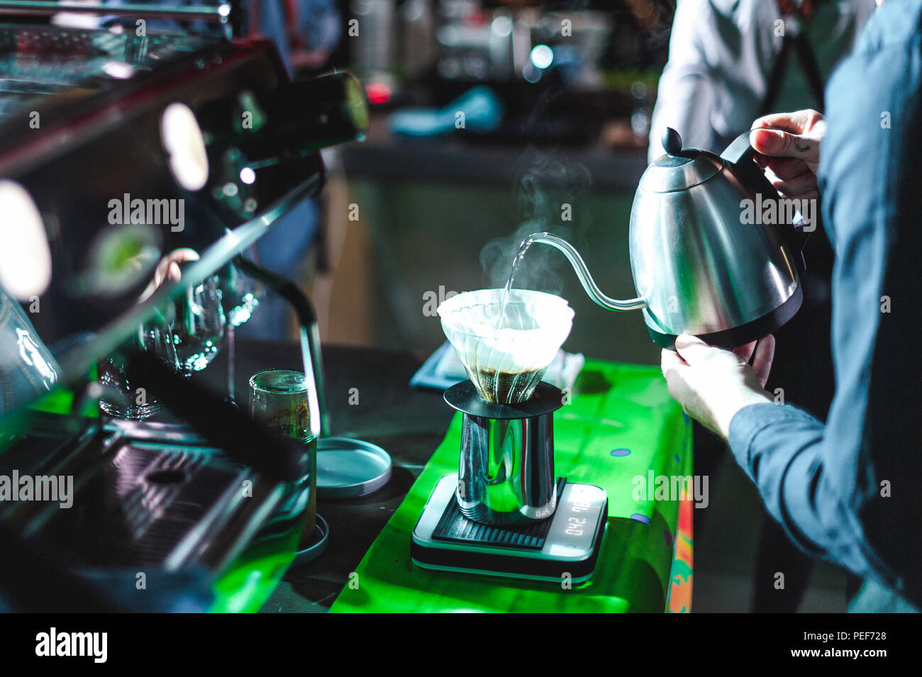 championship among coffee houses, members of teams show barista's skill ...