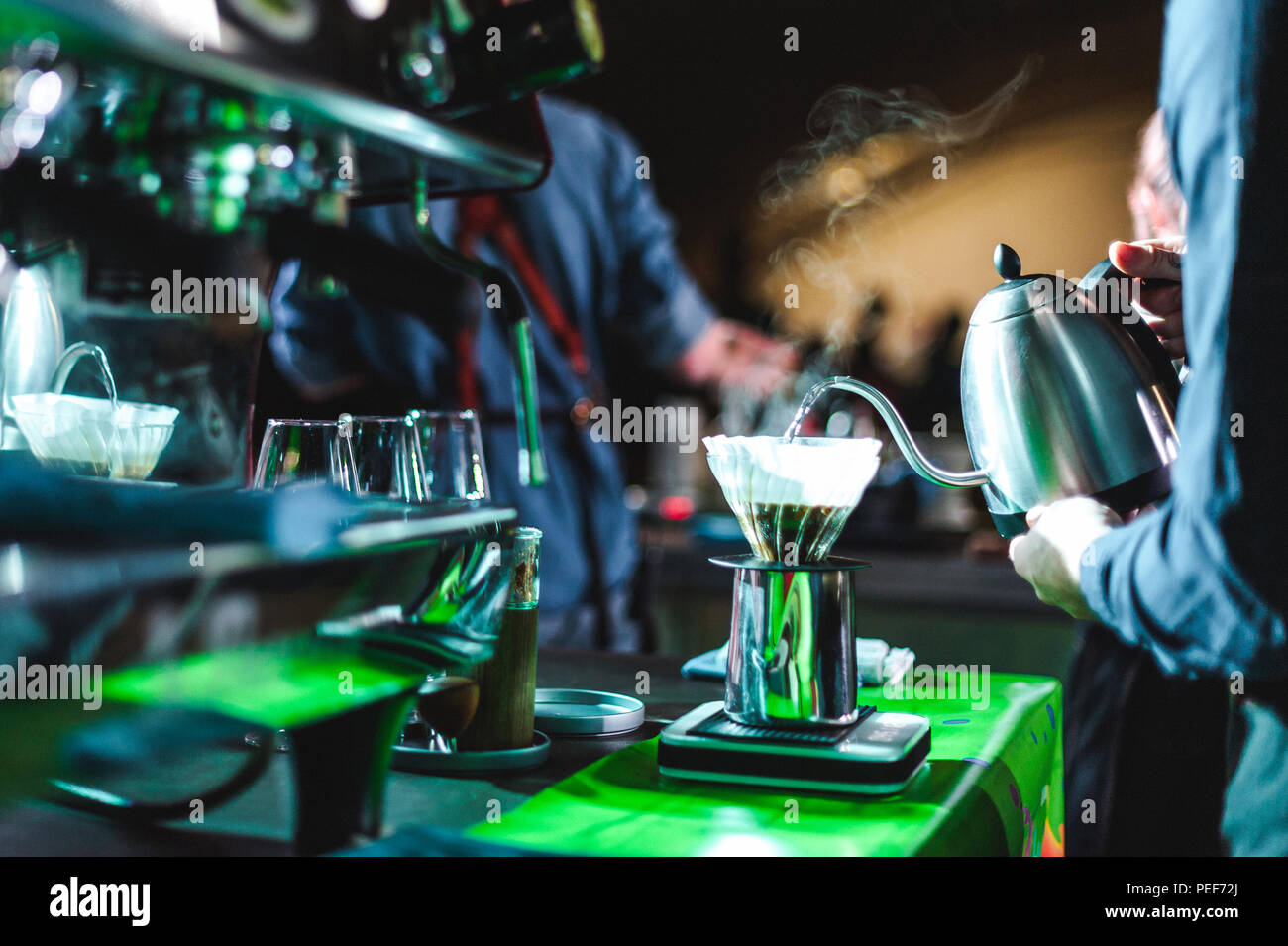 championship among coffee houses, members of teams show barista's skill ...