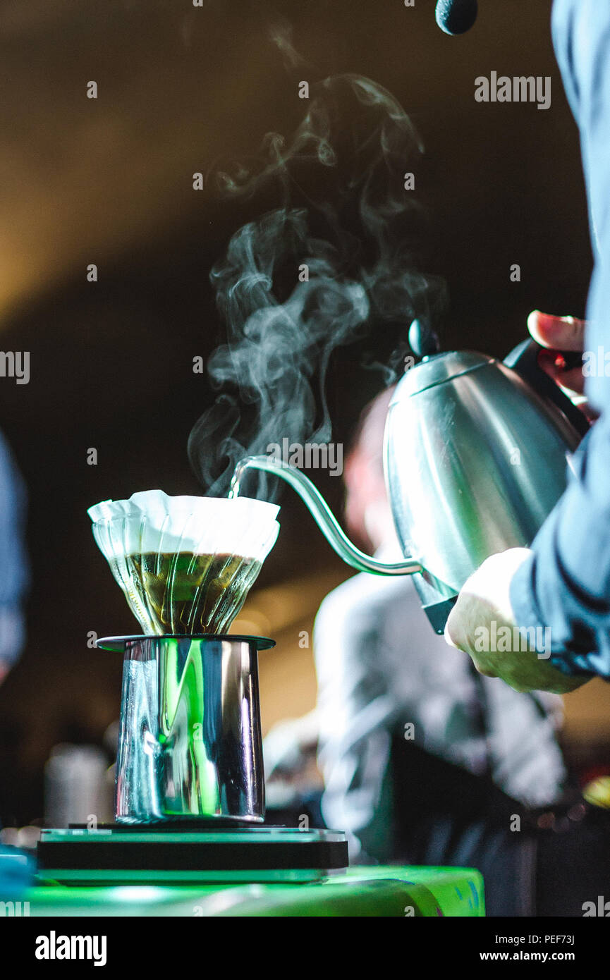 championship among coffee houses, members of teams show barista's skill ...