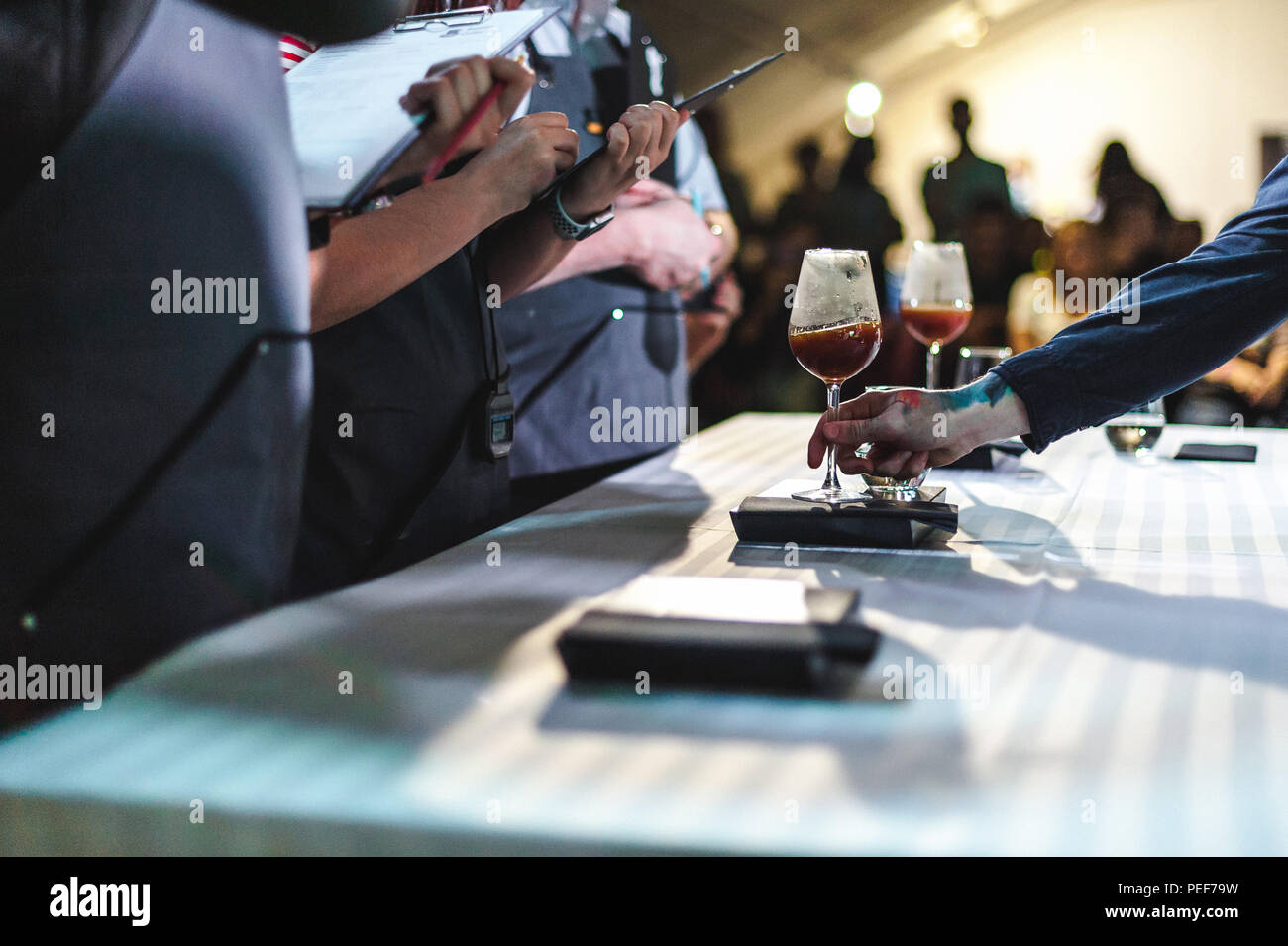 business woman makes notes on a sheet in a notebook, at a restaurant ...