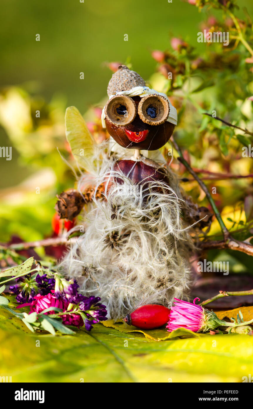 cute funny figures made from autumn fruits, chestnut and acorns posing ...