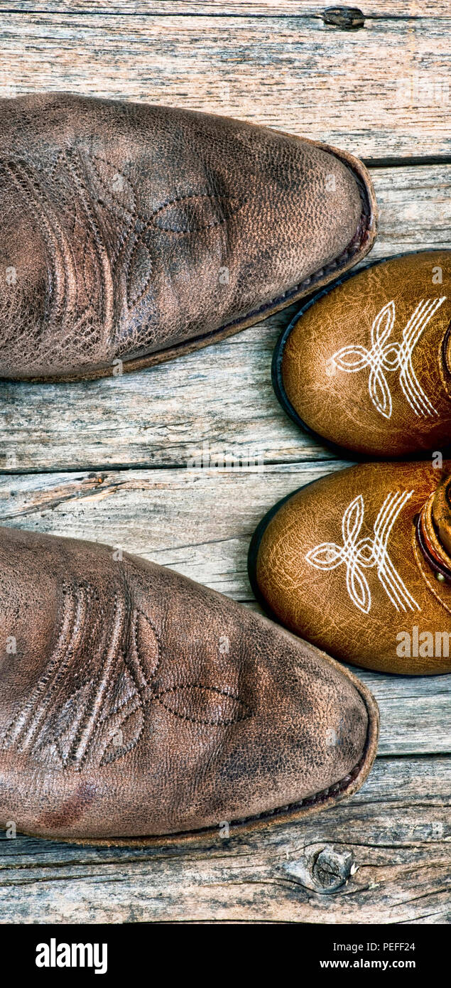 Daddy cowboy and young baby cowboy Stock Photo - Alamy