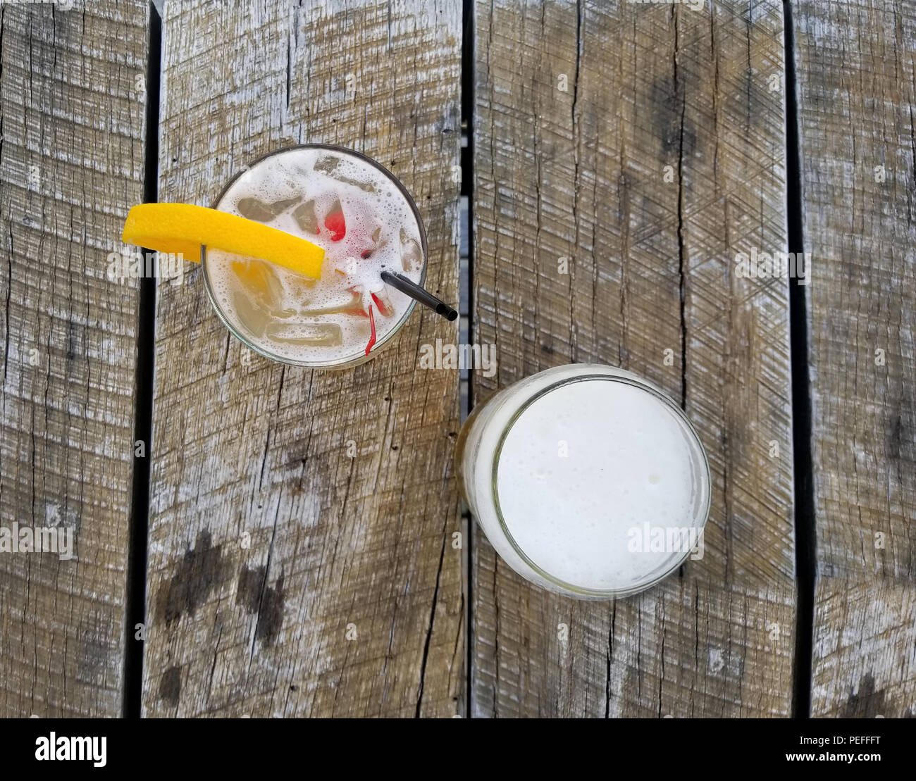 Two drinks on a wooden rustic table. bar table. top view Stock Photo ...