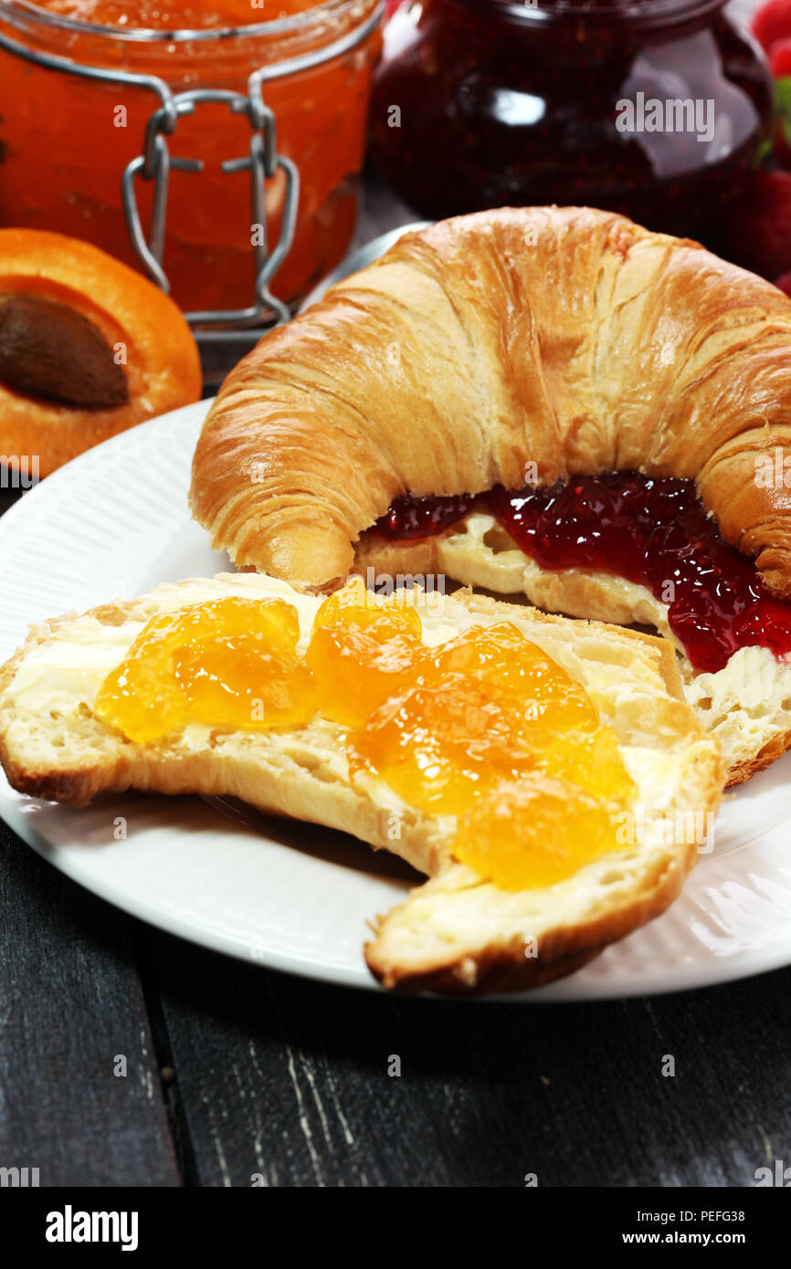croissants with marmalade and assortment of jams, seasonal berries ...