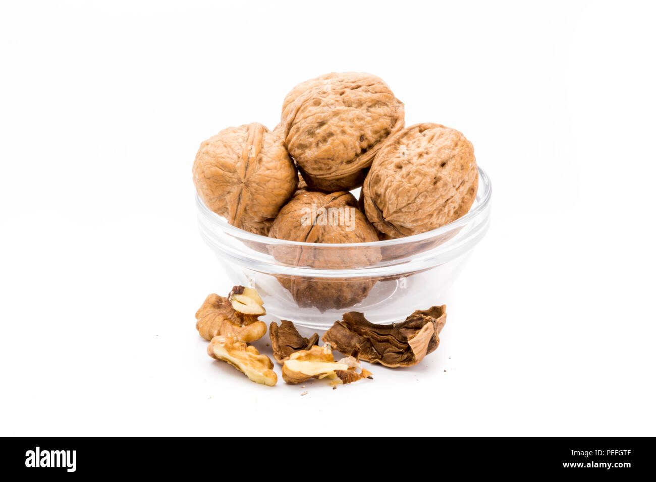 Container with large nuts isolated on a white background Stock Photo ...