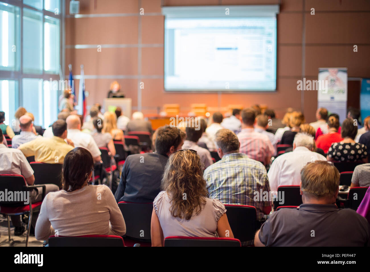 Woman giving presentation on business conference meeting Stock Photo ...