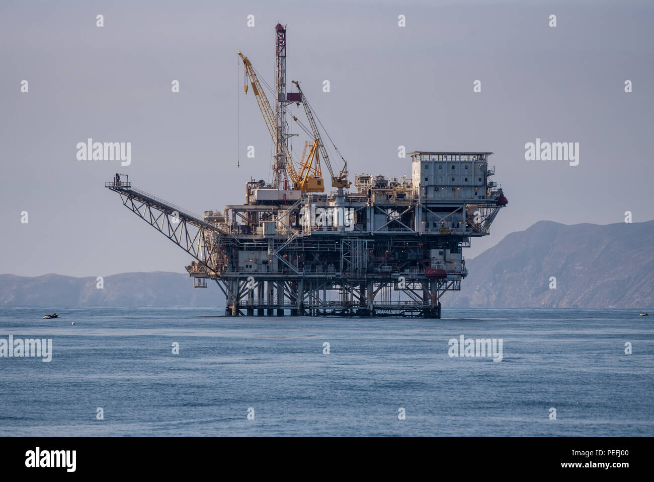 Platform Gina towers above the calm ocean surface with Anacapa Island ...