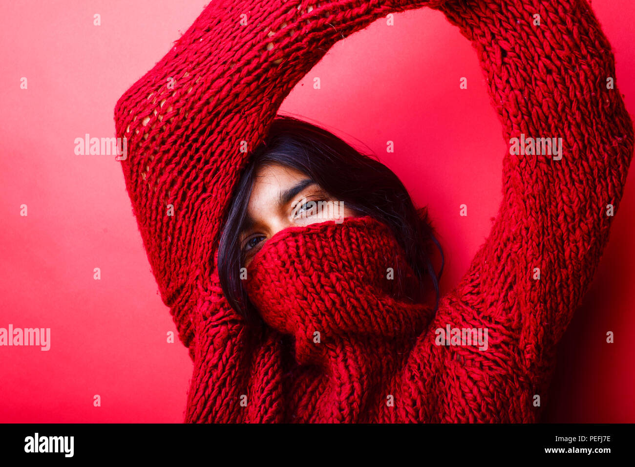 young pretty indian mulatto girl in red sweater posing emotional Stock ...