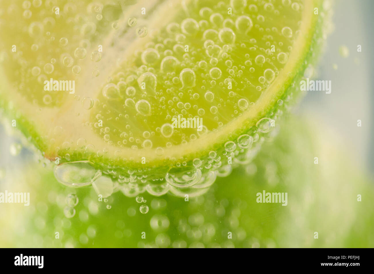 beautiful macro of lime and bubble water for a fresh cocktail Stock ...