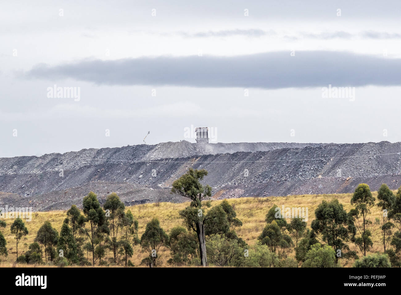Mining dump truck dumping tailings Stock Photo - Alamy