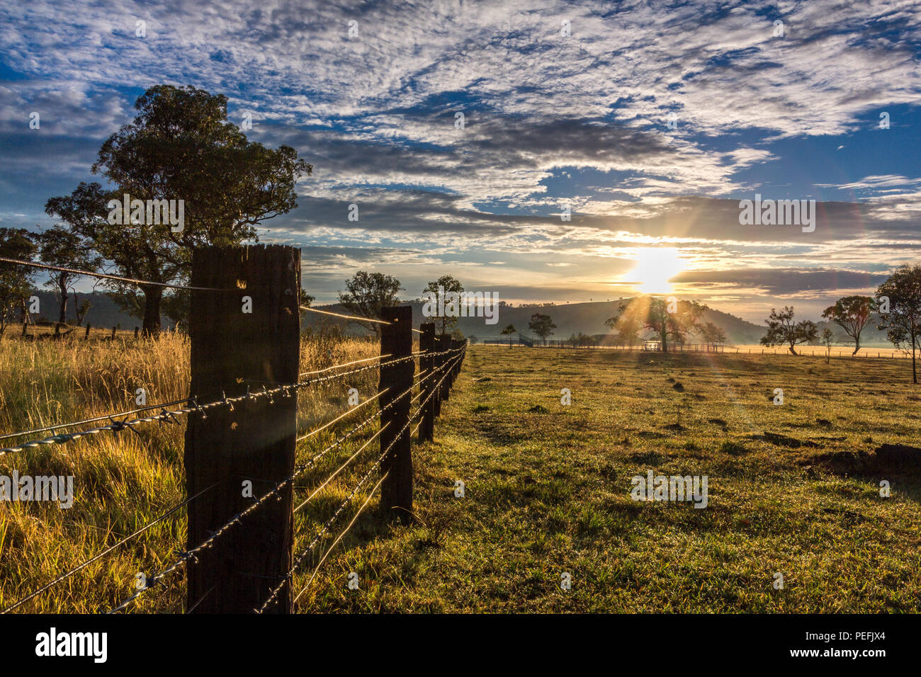 Rising sun over farmland hi-res stock photography and images - Alamy