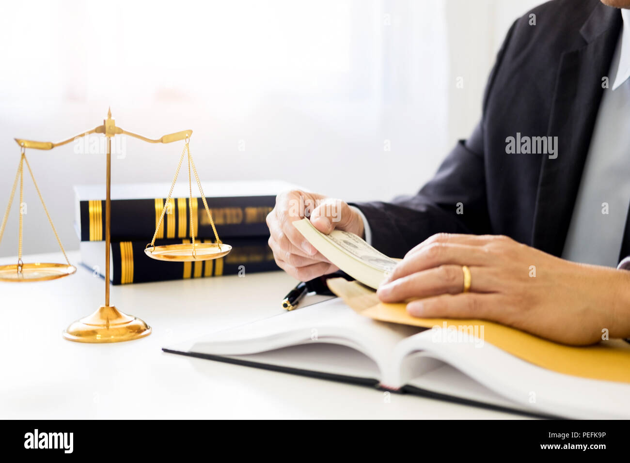Lawyer being offered receiving money as bribe from client at desk in ...