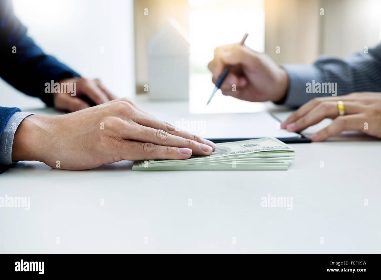 Businessman giving end key to customer after good deal agreement. while ...