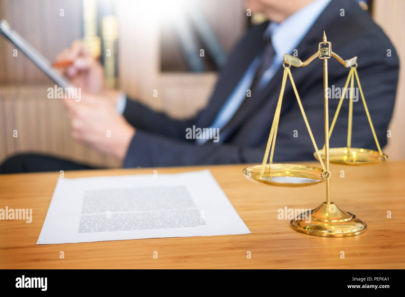 lawyer judge reading documents at desk in courtroom working on wooden ...