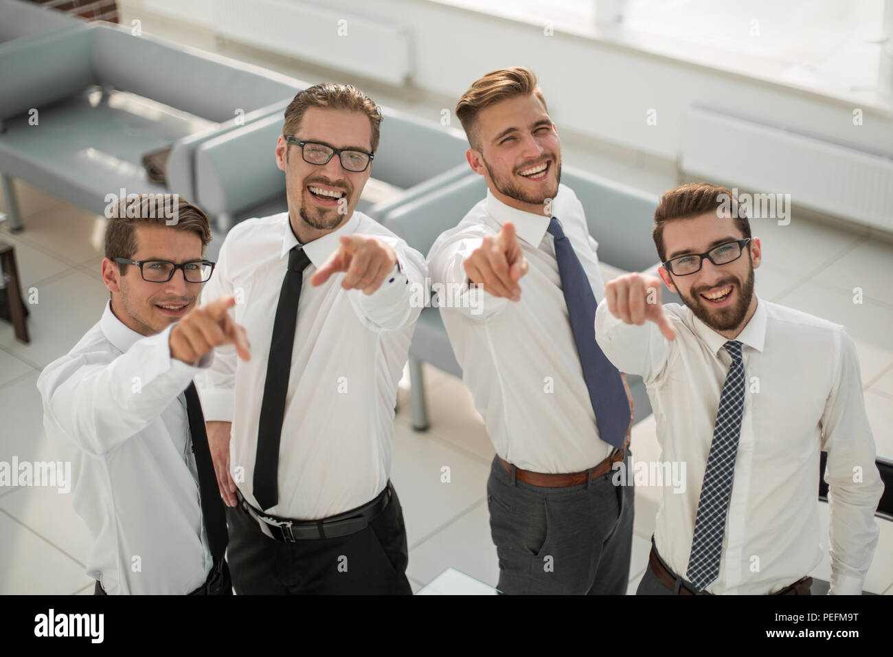 group of successful employees pointing to you.the concept of choice ...