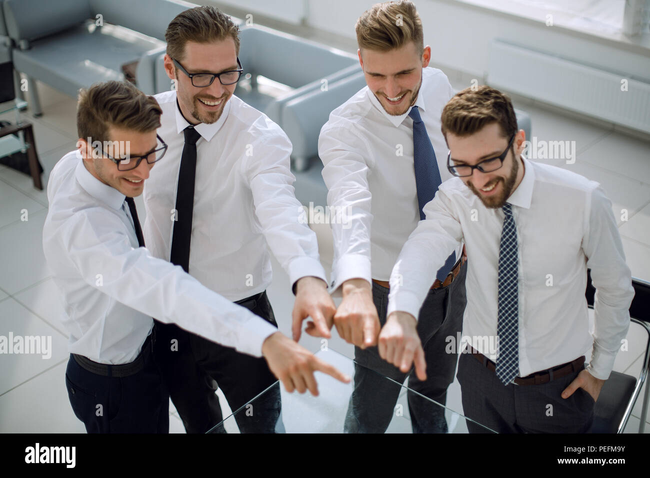 group of successful employees pointing to you.the concept of choice ...