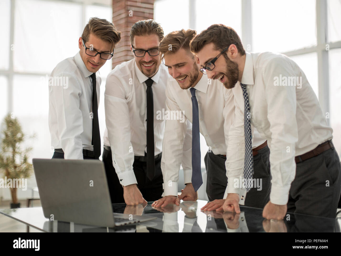 close up.a group of employees looking at the laptop screen.people and ...
