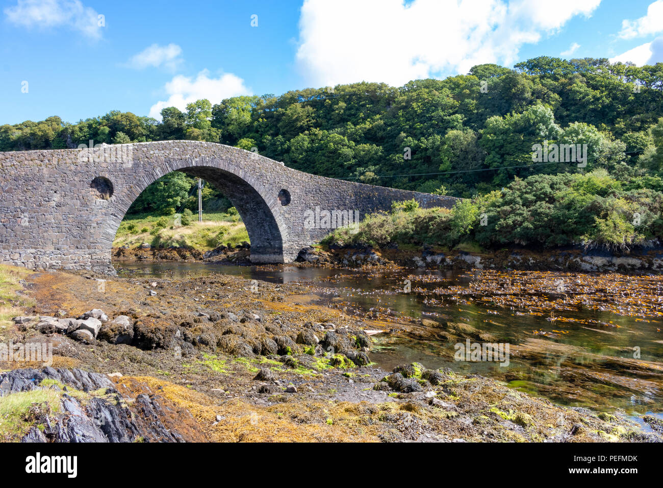 Historic stone Clachan Bridge (Atlantic Bridge) connecting the Isle of ...