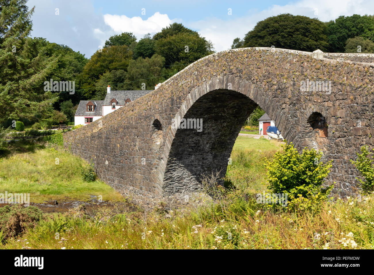 Historic stone Clachan Bridge (Atlantic Bridge) connecting the Isle of ...