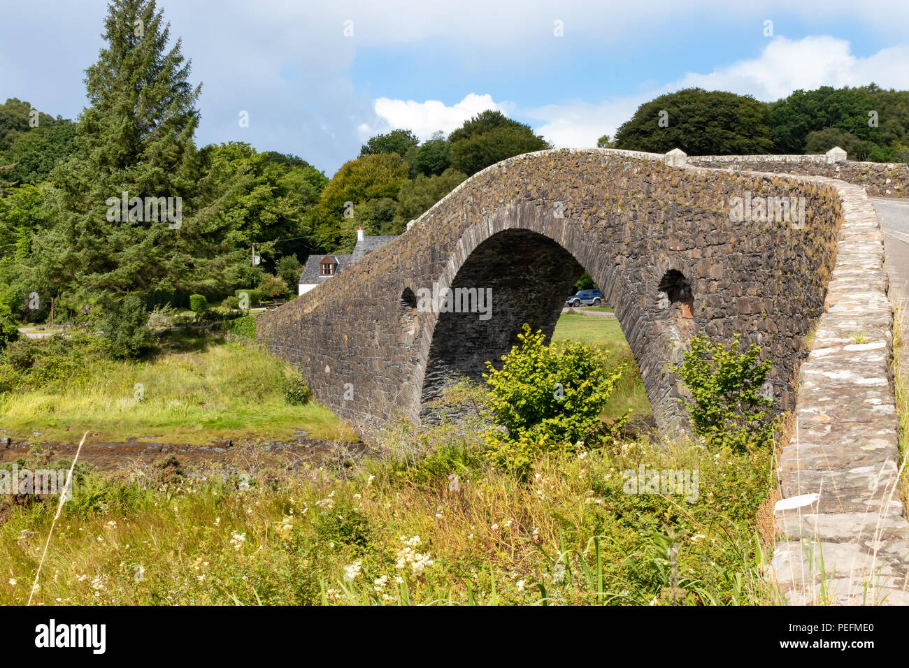 Historic stone Clachan Bridge (Atlantic Bridge) connecting the Isle of ...