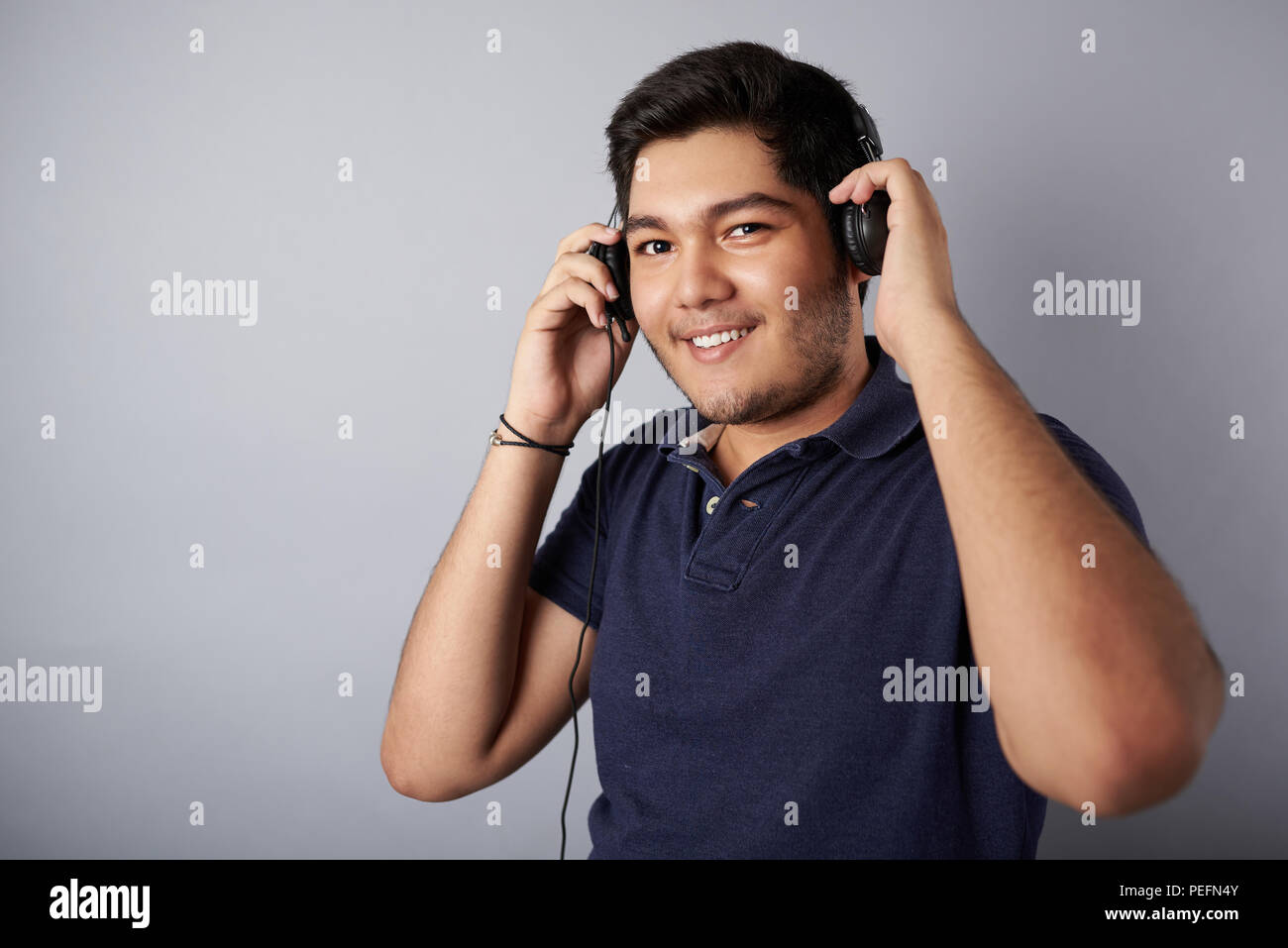 Happy man listening music hi-res stock photography and images - Alamy