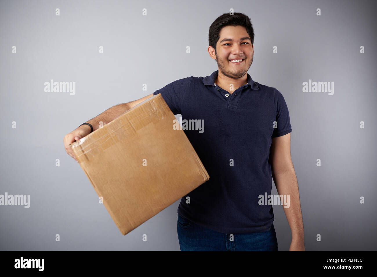 Delivery man package hi-res stock photography and images - Alamy