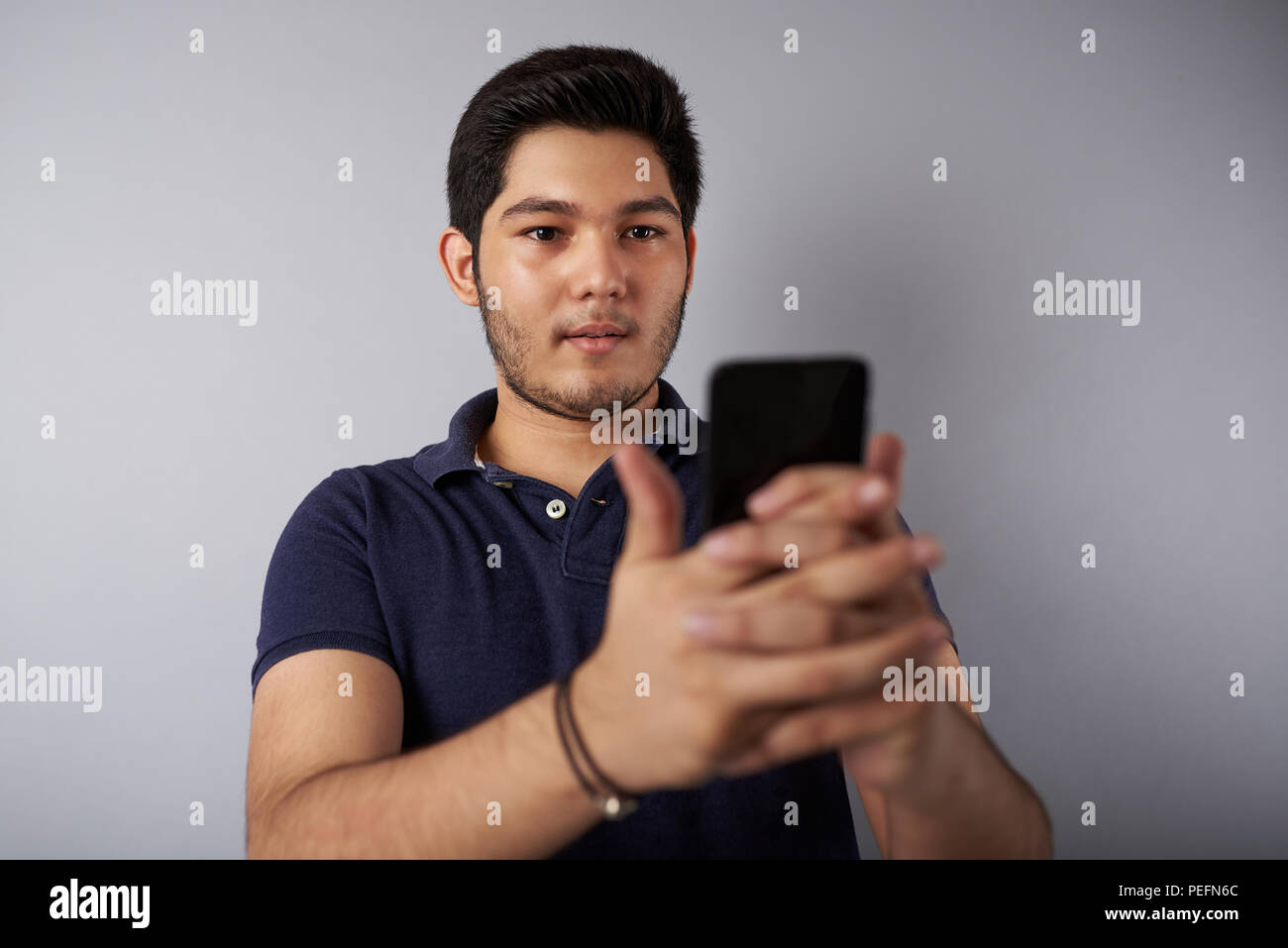 Attractive man using cell telephone hi-res stock photography and images ...
