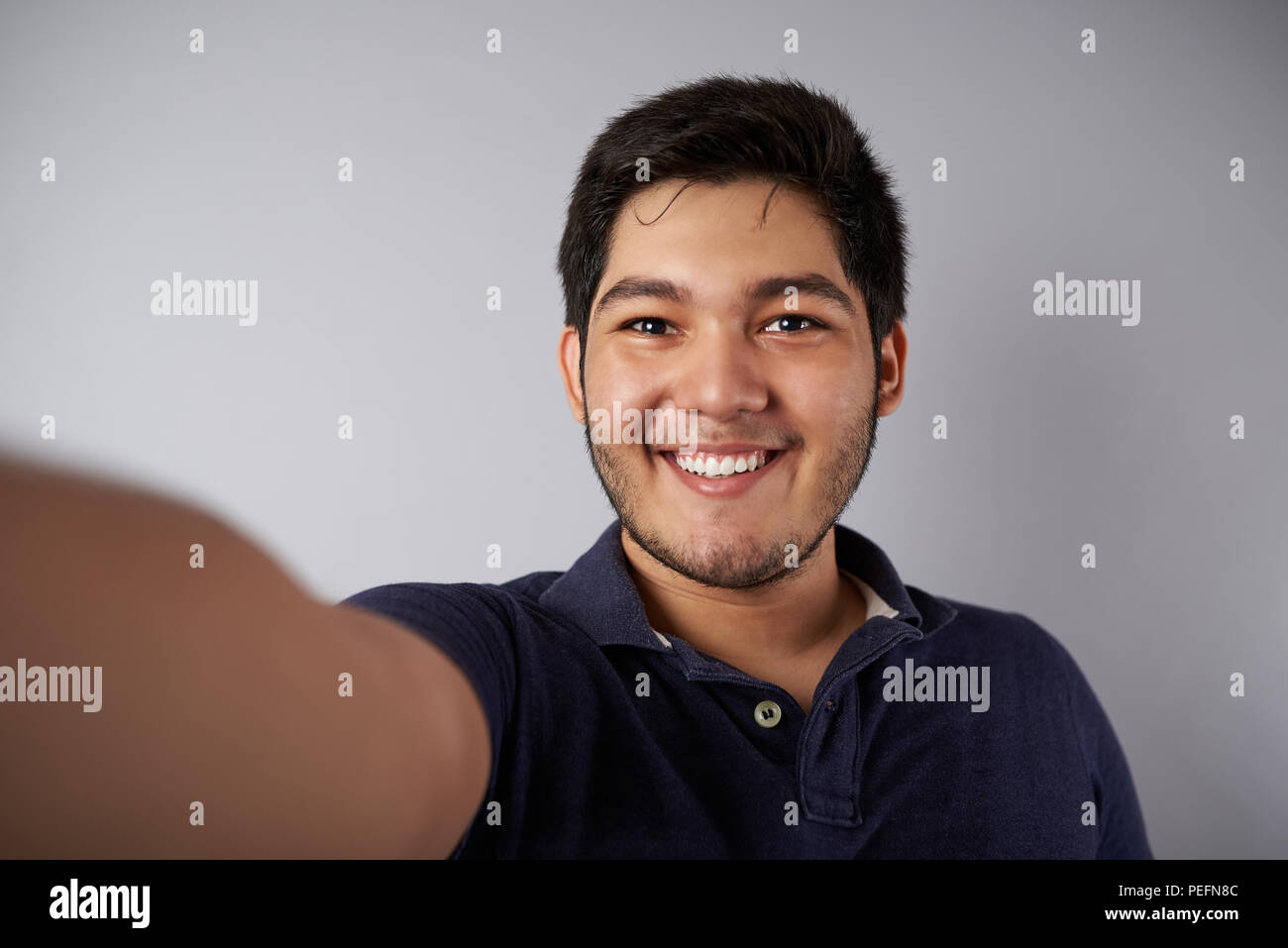 Selfie effect view. Man smile while doing selfie Stock Photo - Alamy