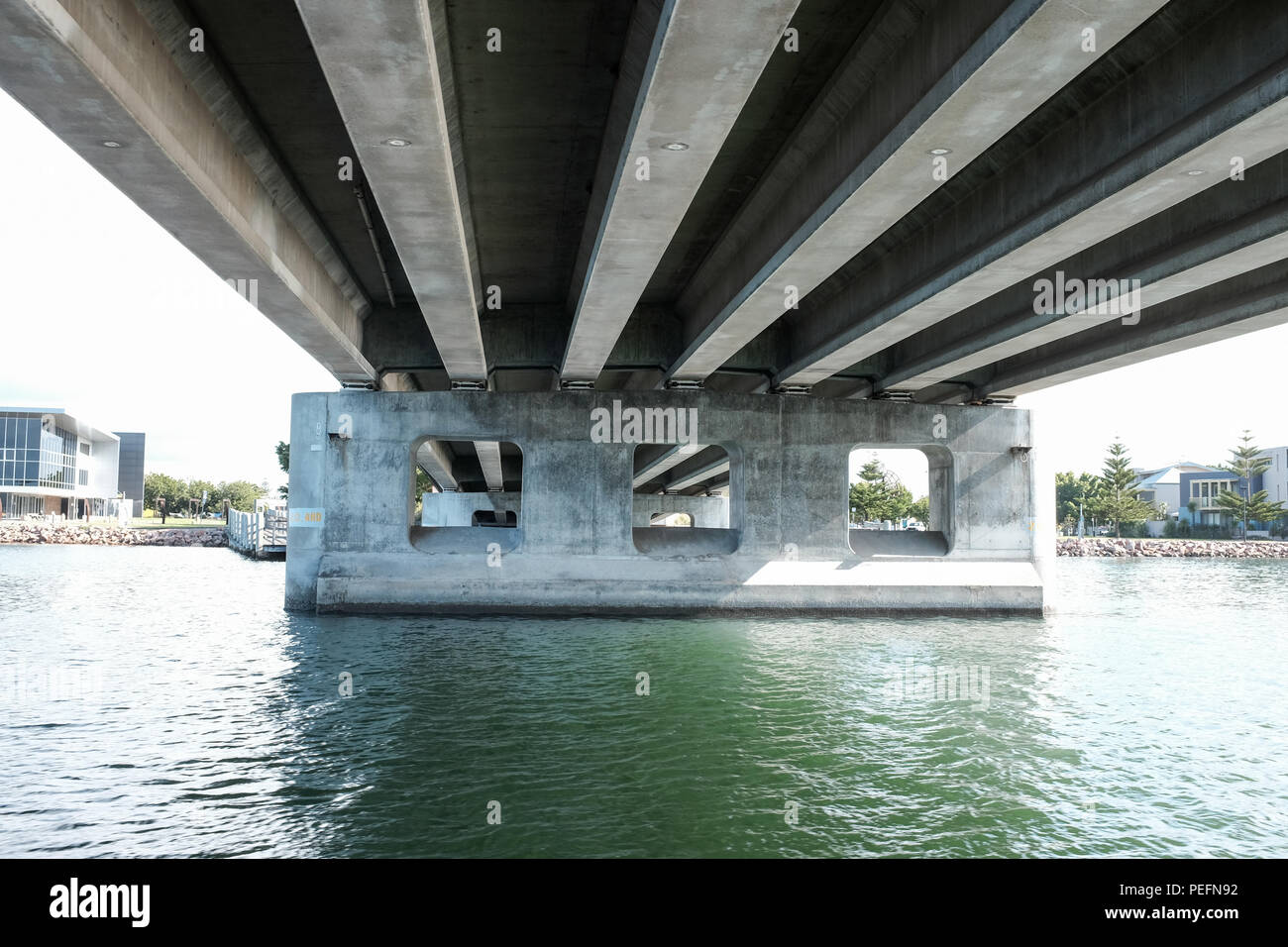 View of underneath concrete bridge from the river Stock Photo - Alamy