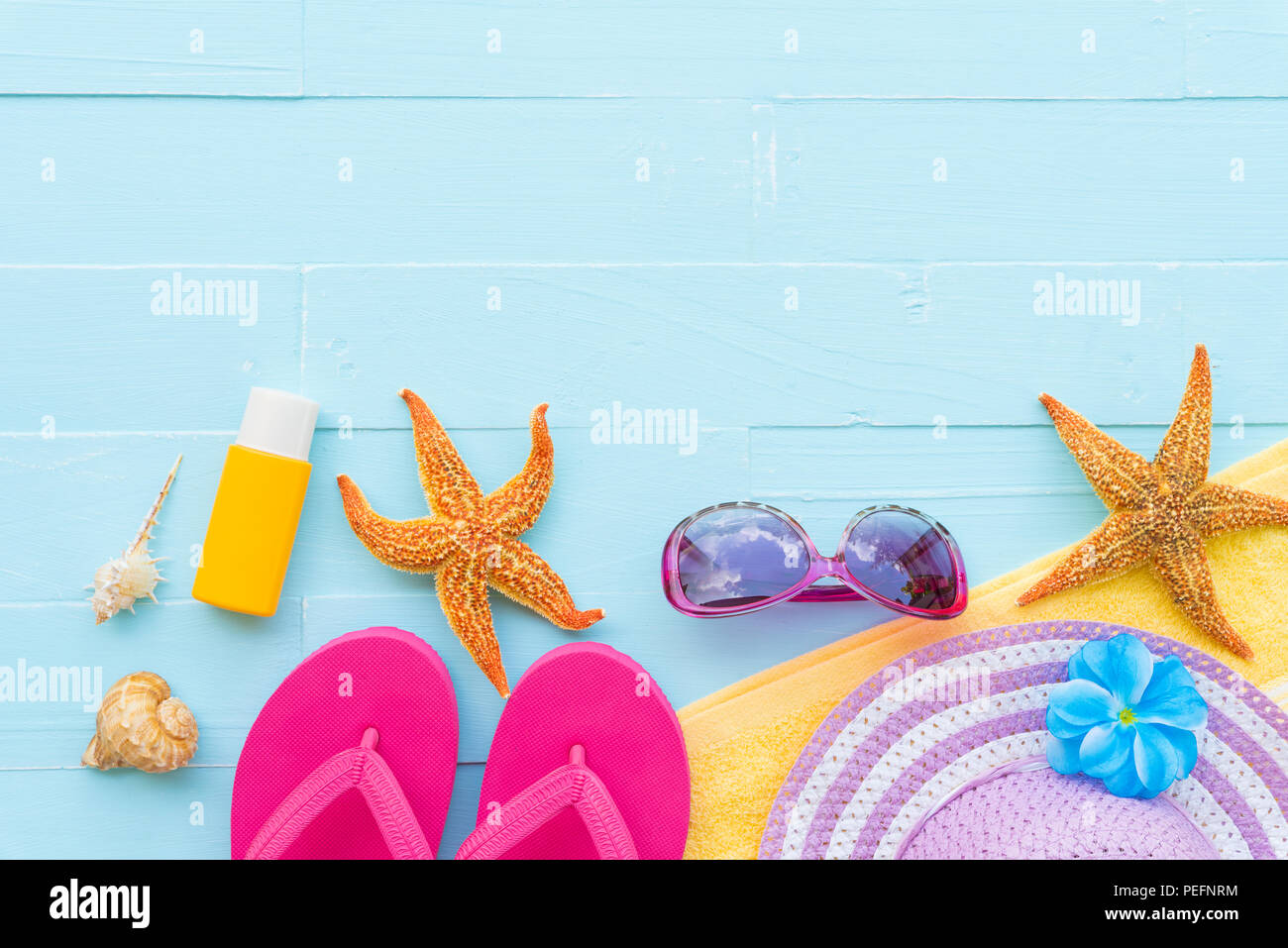 Beach accessories including sunglasses, starfish, hat beach, sunblock ...