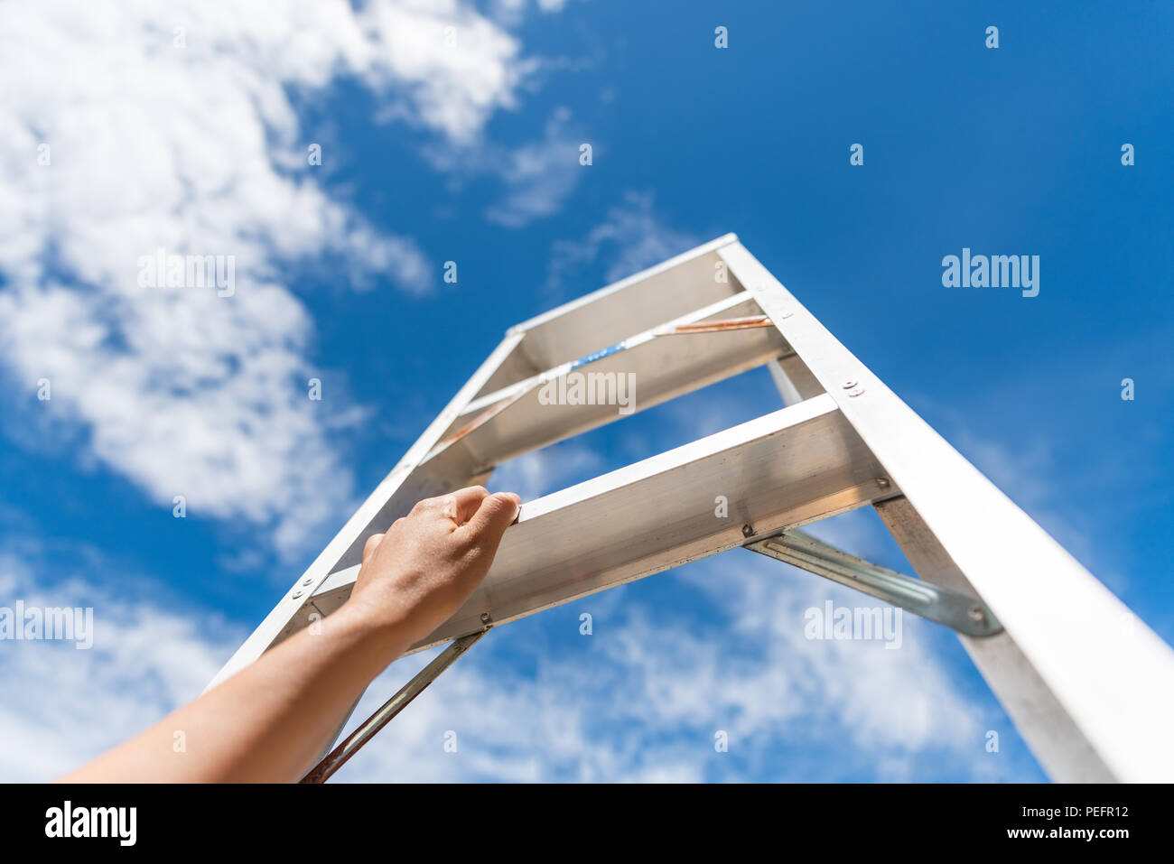 Male climbing up step ladder hi-res stock photography and images - Alamy