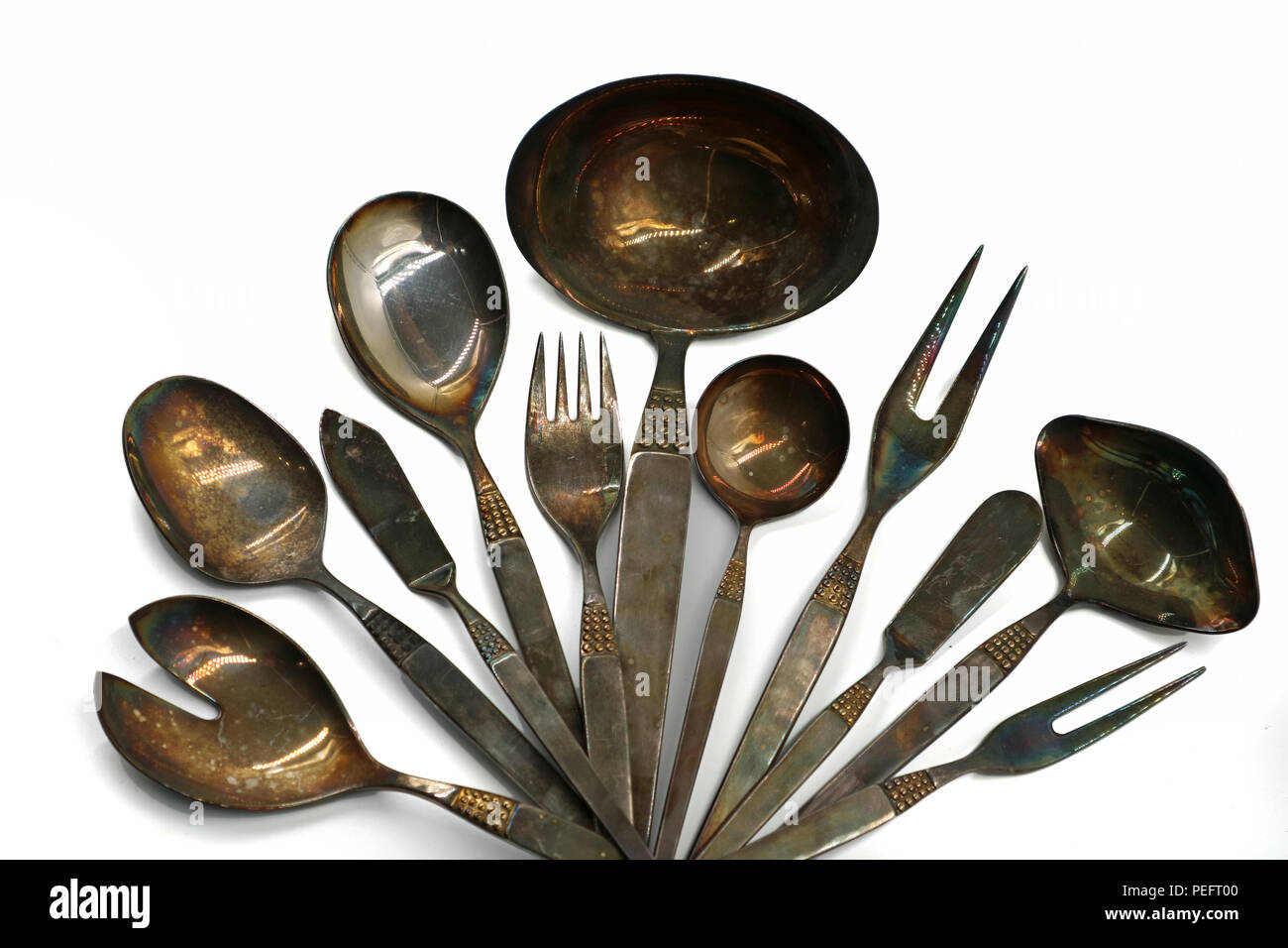 Old silver cutlery isolated on white background Stock Photo - Alamy