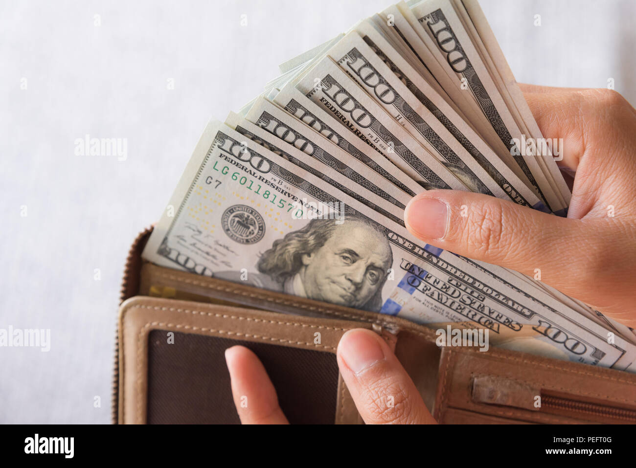 Woman taking cash out from hi-res stock photography and images - Alamy