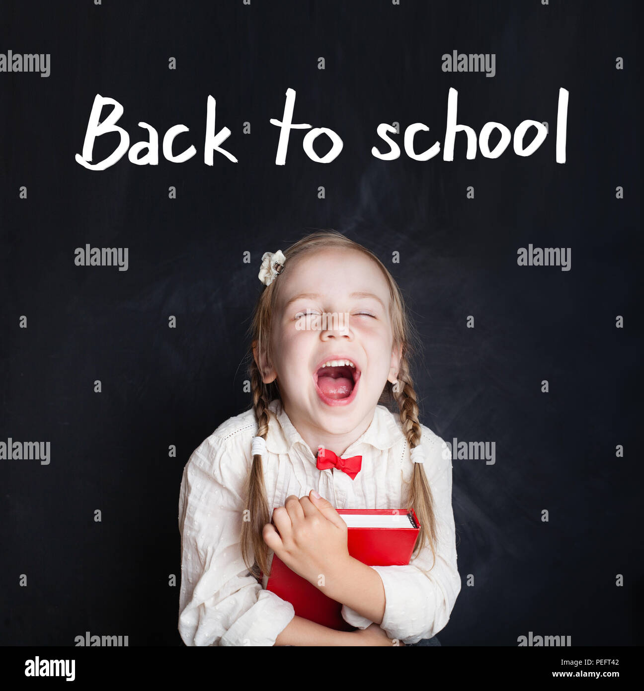 Pupil girl having fun because she goes to school for the first time ...